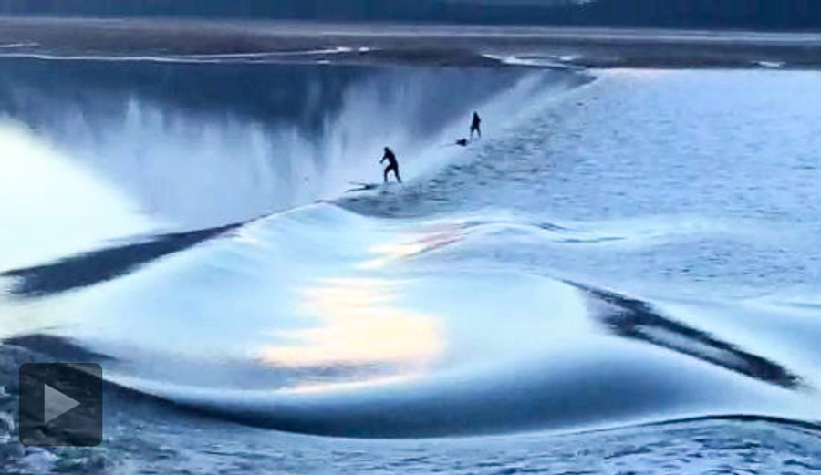 Paddleboarders Surf Alaskan Bore Tide Along Turnagain Arm | The Inertia