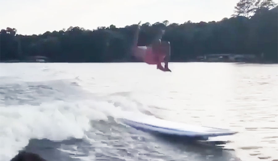 Watch This Guy Do a Standing Backflip on a Longboard Behind a Boat ...