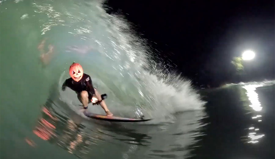 Mason Ho Puts on the Pumpkin Head for a Halloween Night Surf