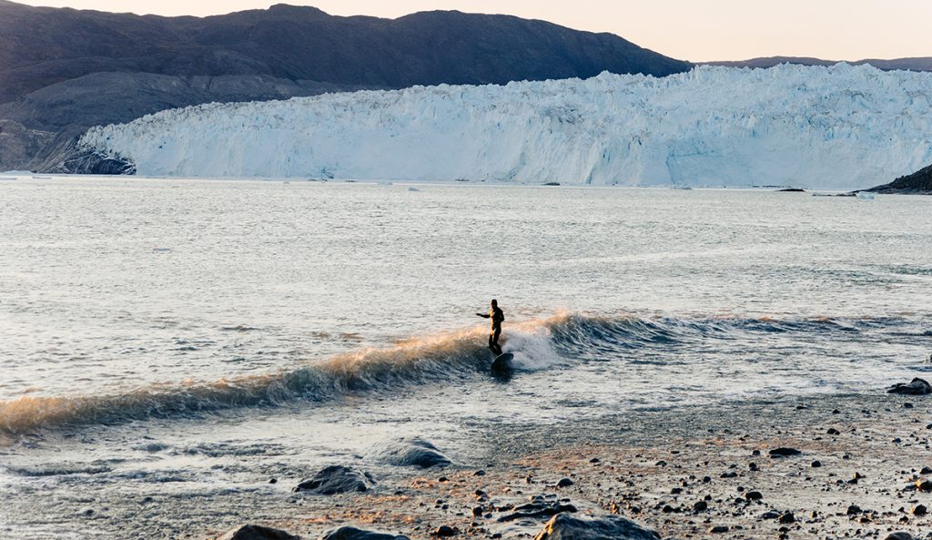 Surfer Rides Incredible Calving Glacier Wave in Greenland